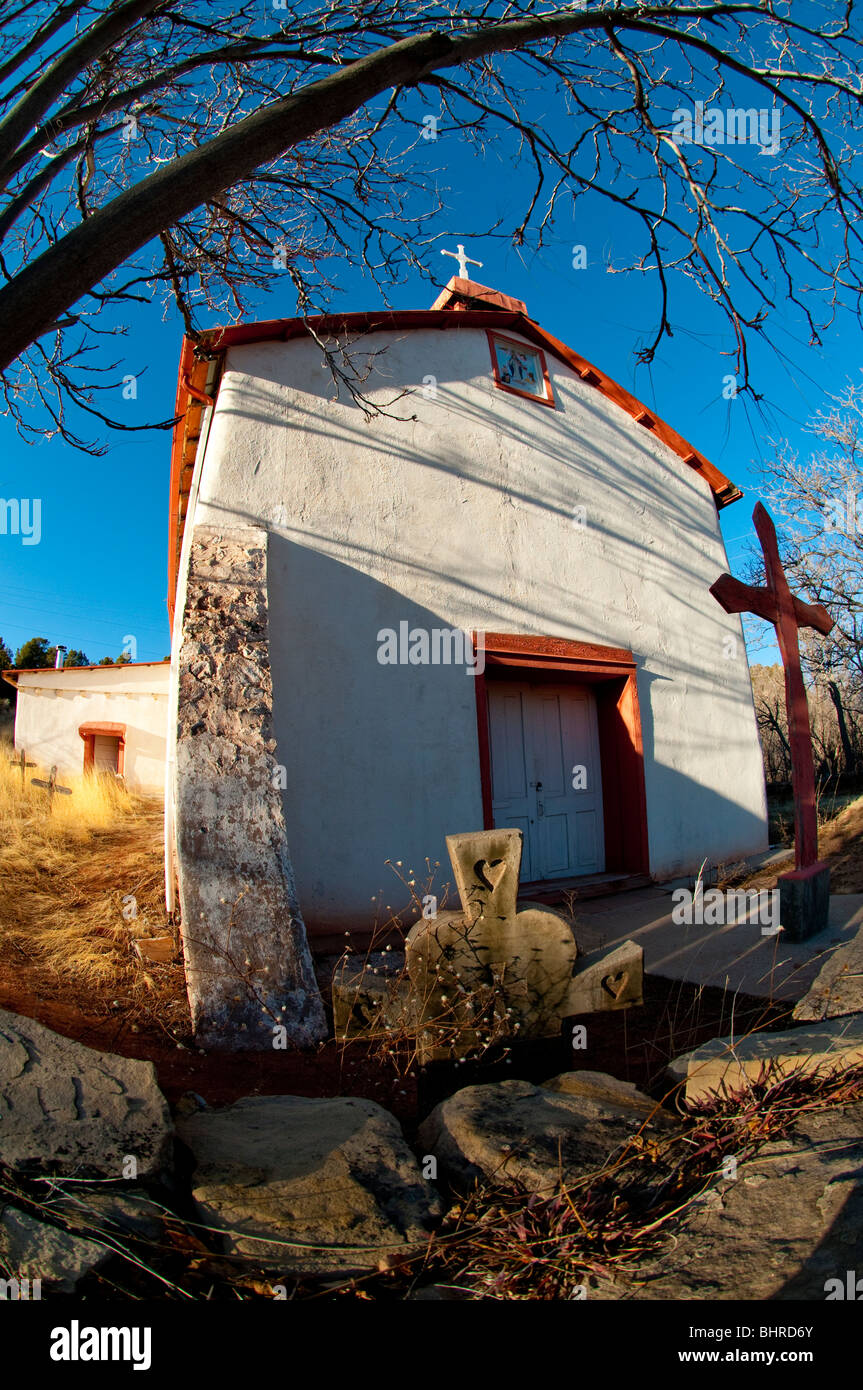Fish eye view of southwest catholic church with deep blue sky and ...