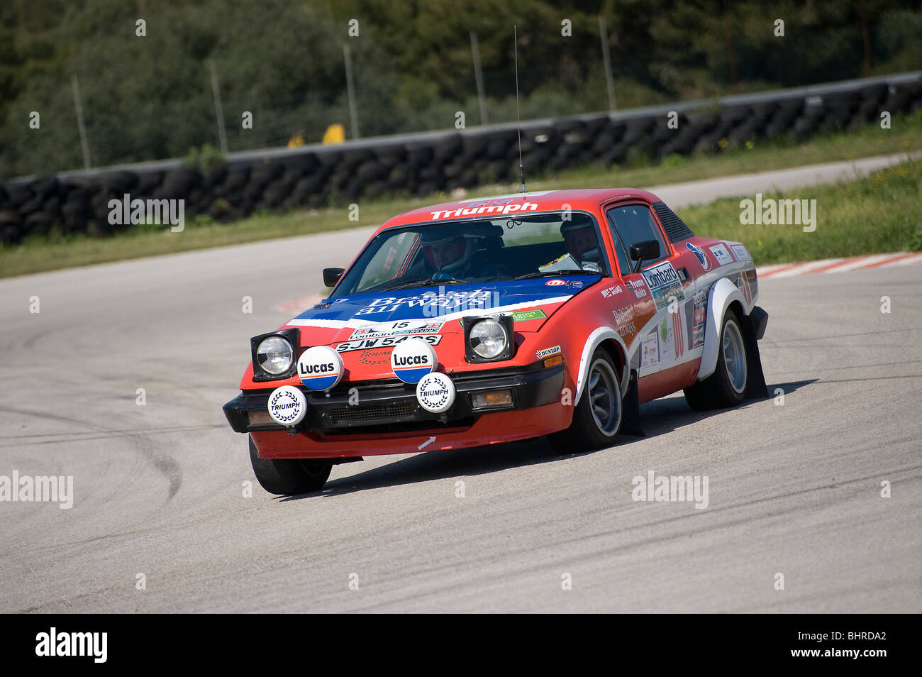 Red Triumph TR8 ex works car racing in a classic car rally in Spain ...