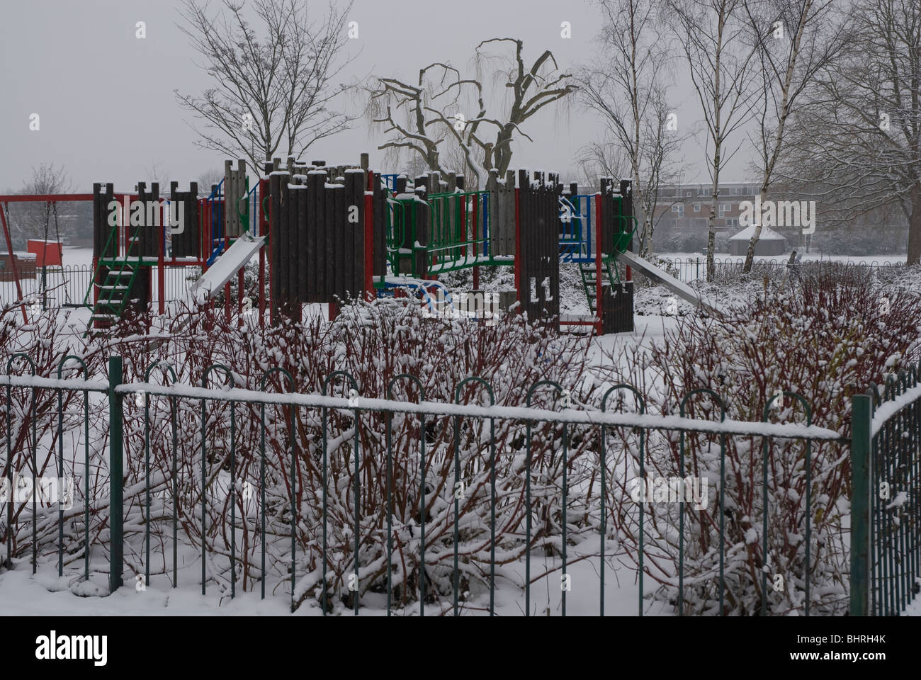 Childrens playground in the snow, Heston Park West London UK Stock ...