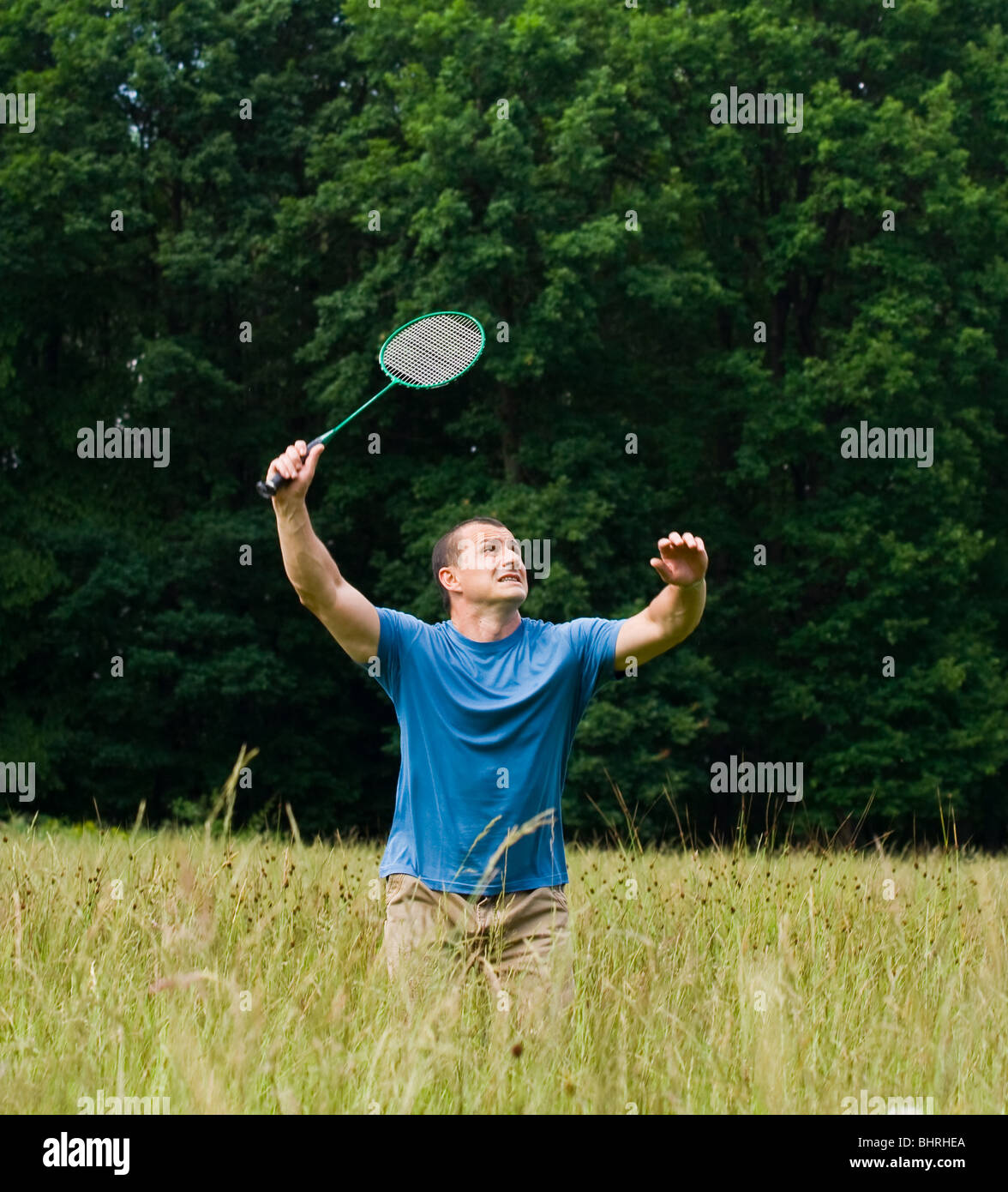Young man playing badminton in a sunny day Stock Photo - Alamy