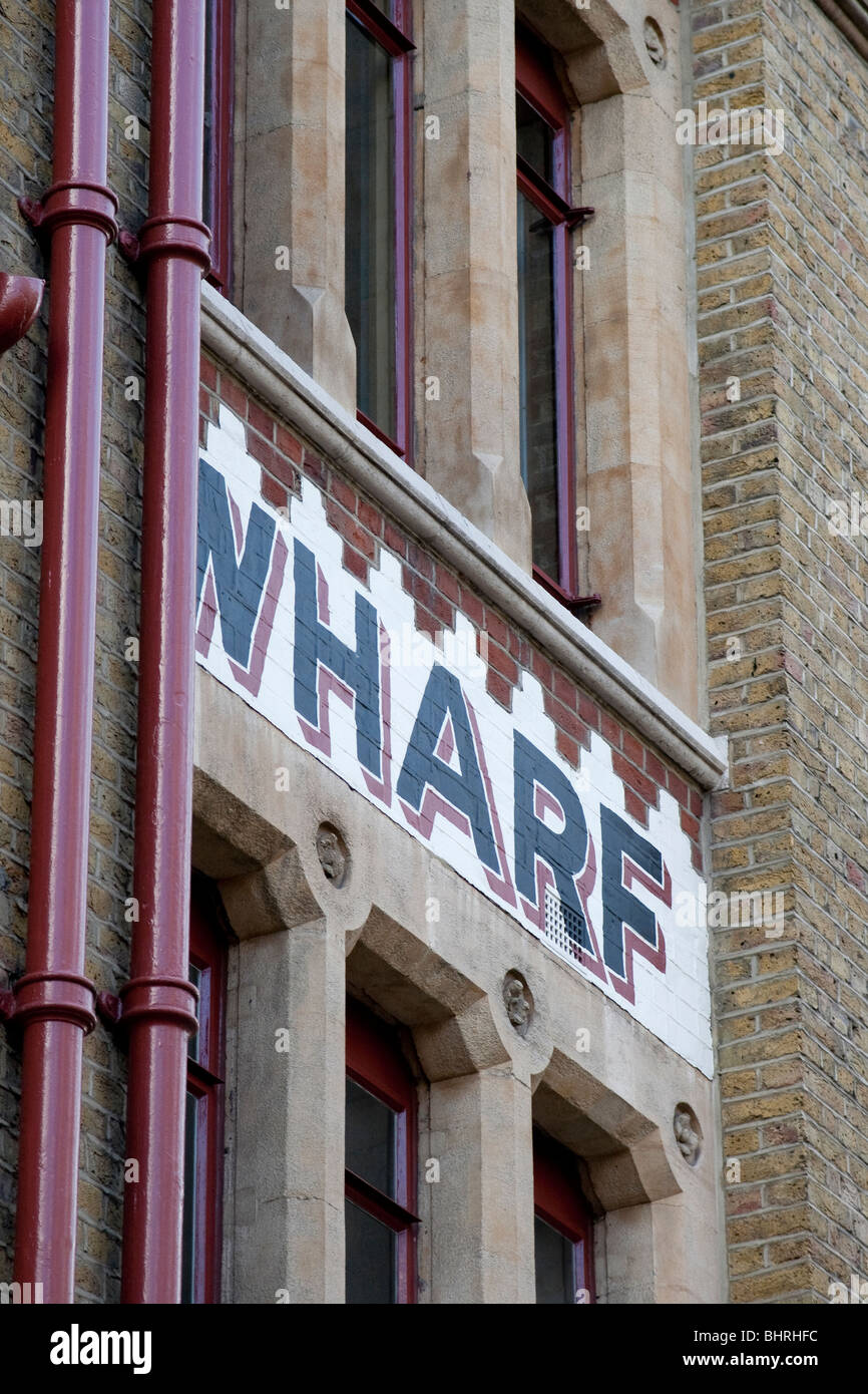A Wharf sign painted on the surface of a building Stock Photo - Alamy