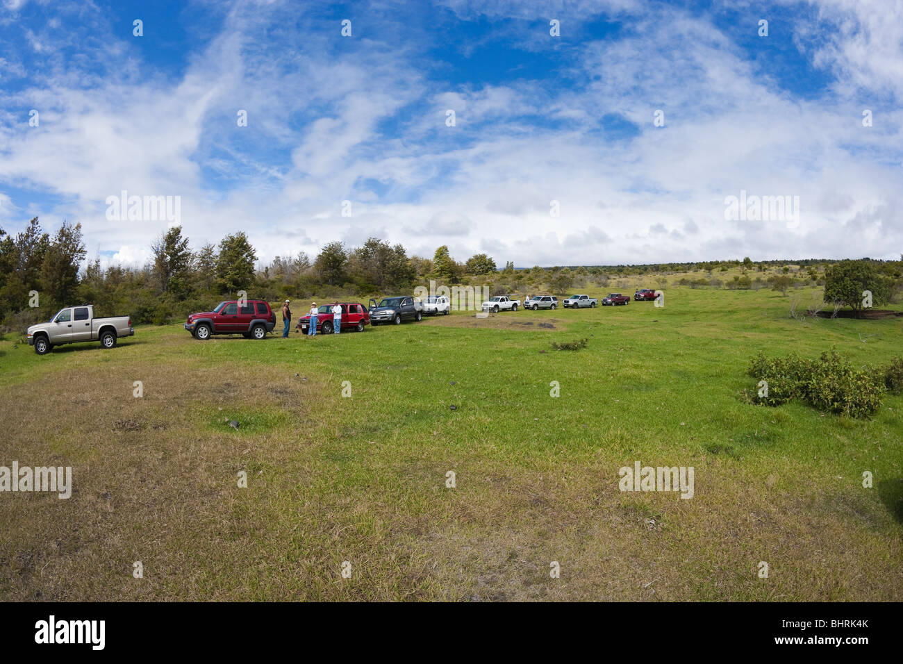 Caravan of four wheel drive vehicles tours Kapapala Ranch in Kau ...