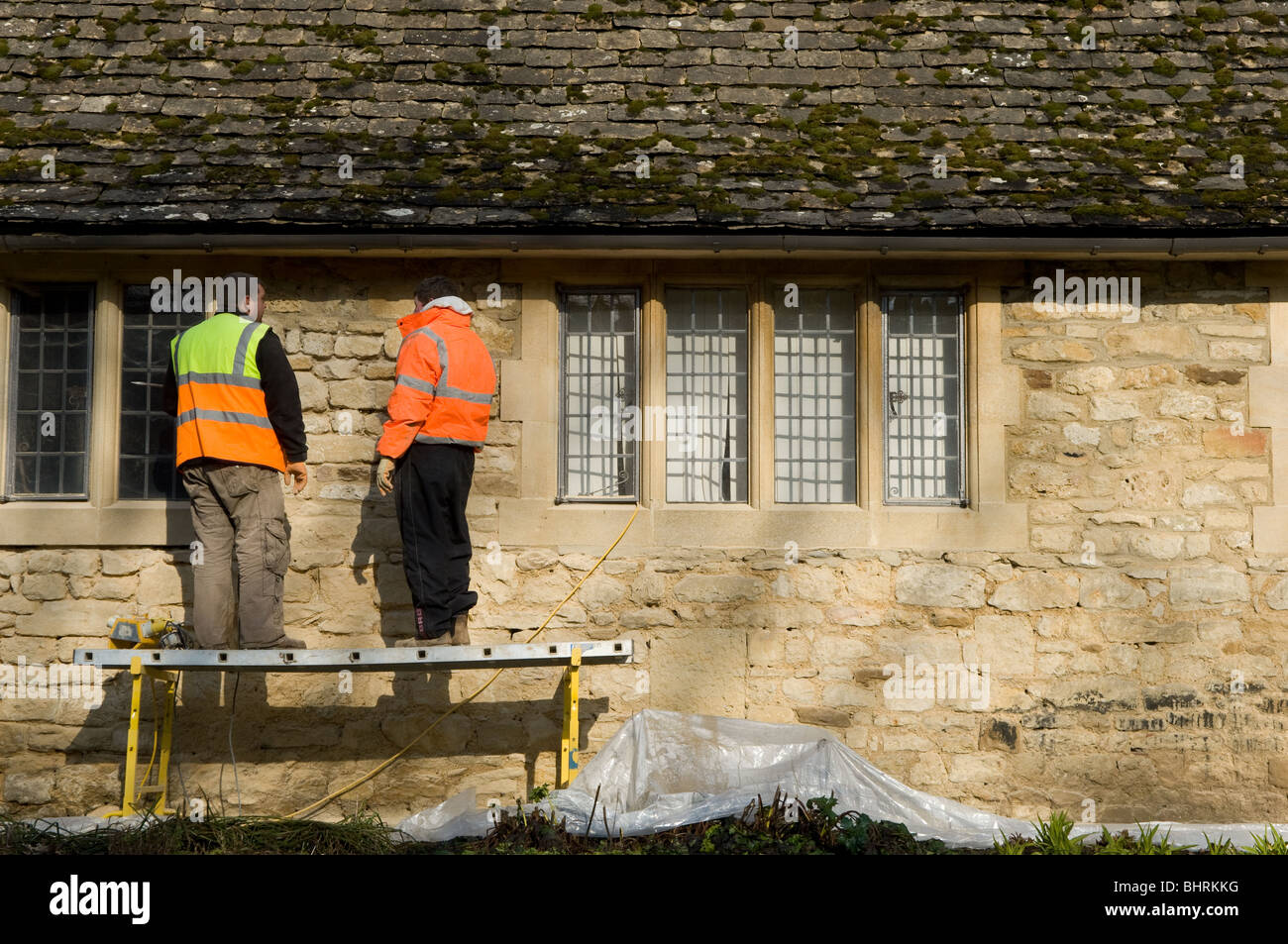 Bricklayers pointing up stone work at Christ Church College, Oxford ...