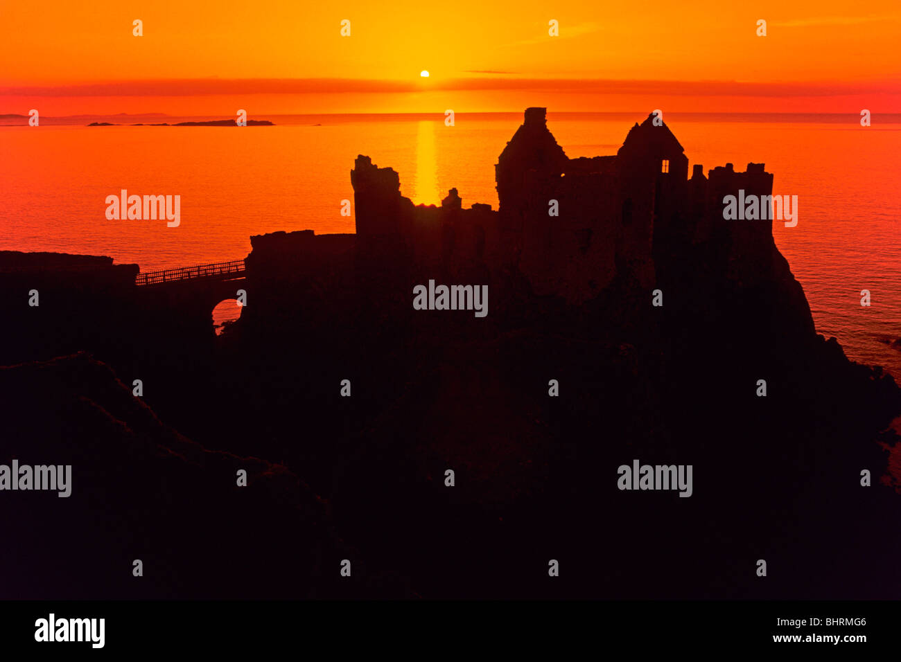 Silhouette of Dunluce Castle at sunset, Co. Antrim, Northern Ireland ...