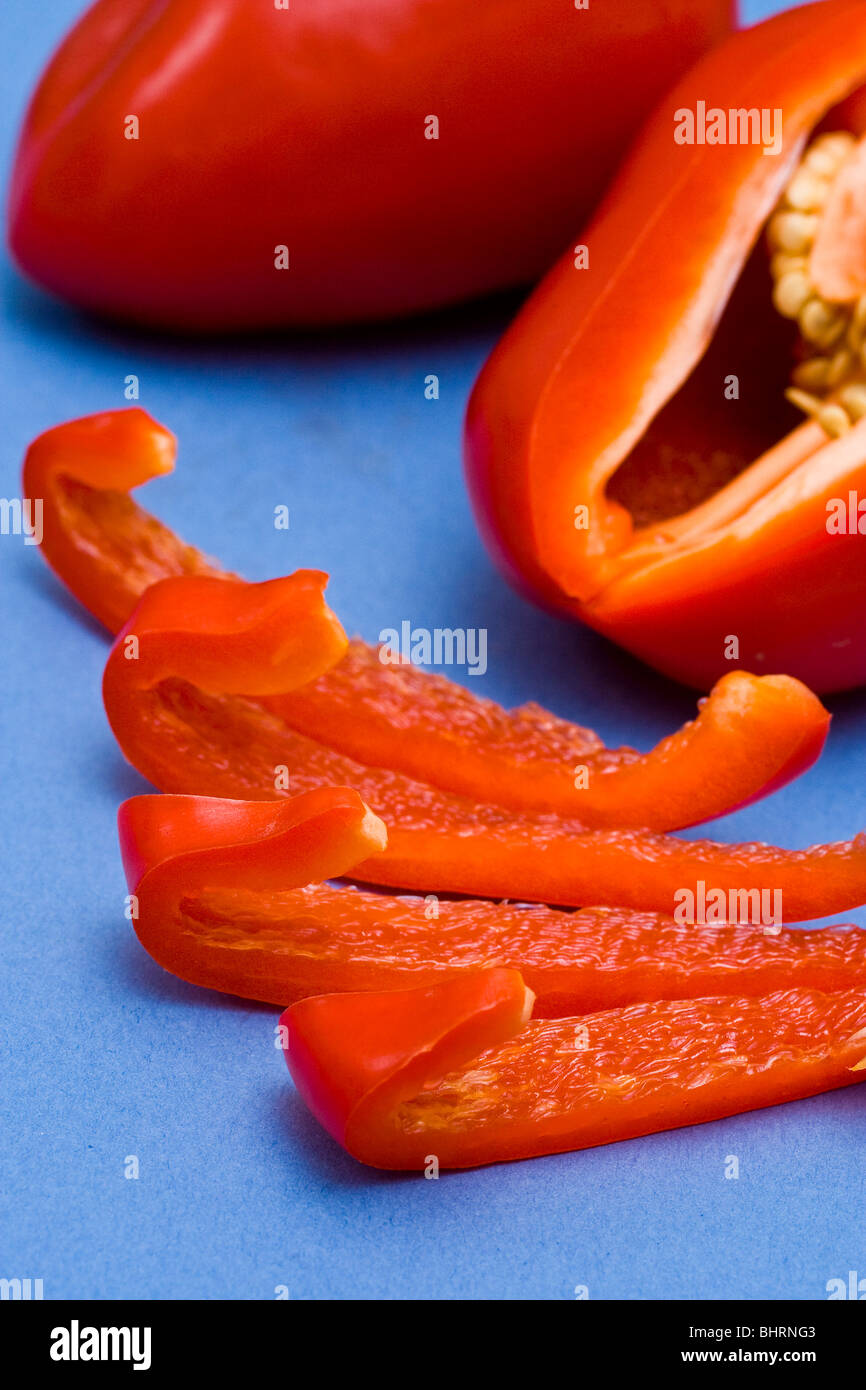 Red pepper isolated on blue background Stock Photo - Alamy