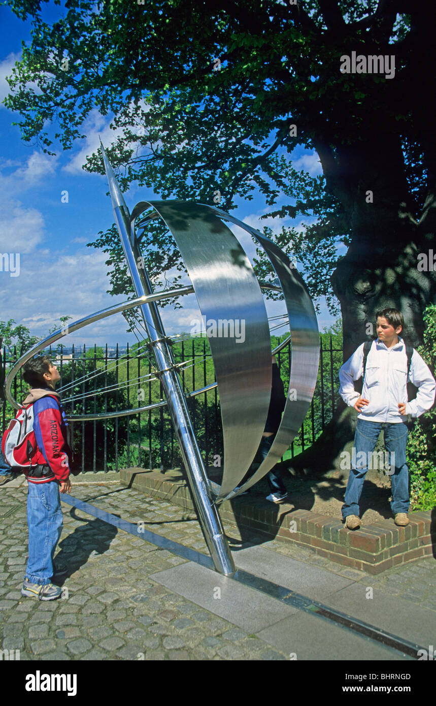 two young boys visiting the prime meridian, Greenwich, London, England ...
