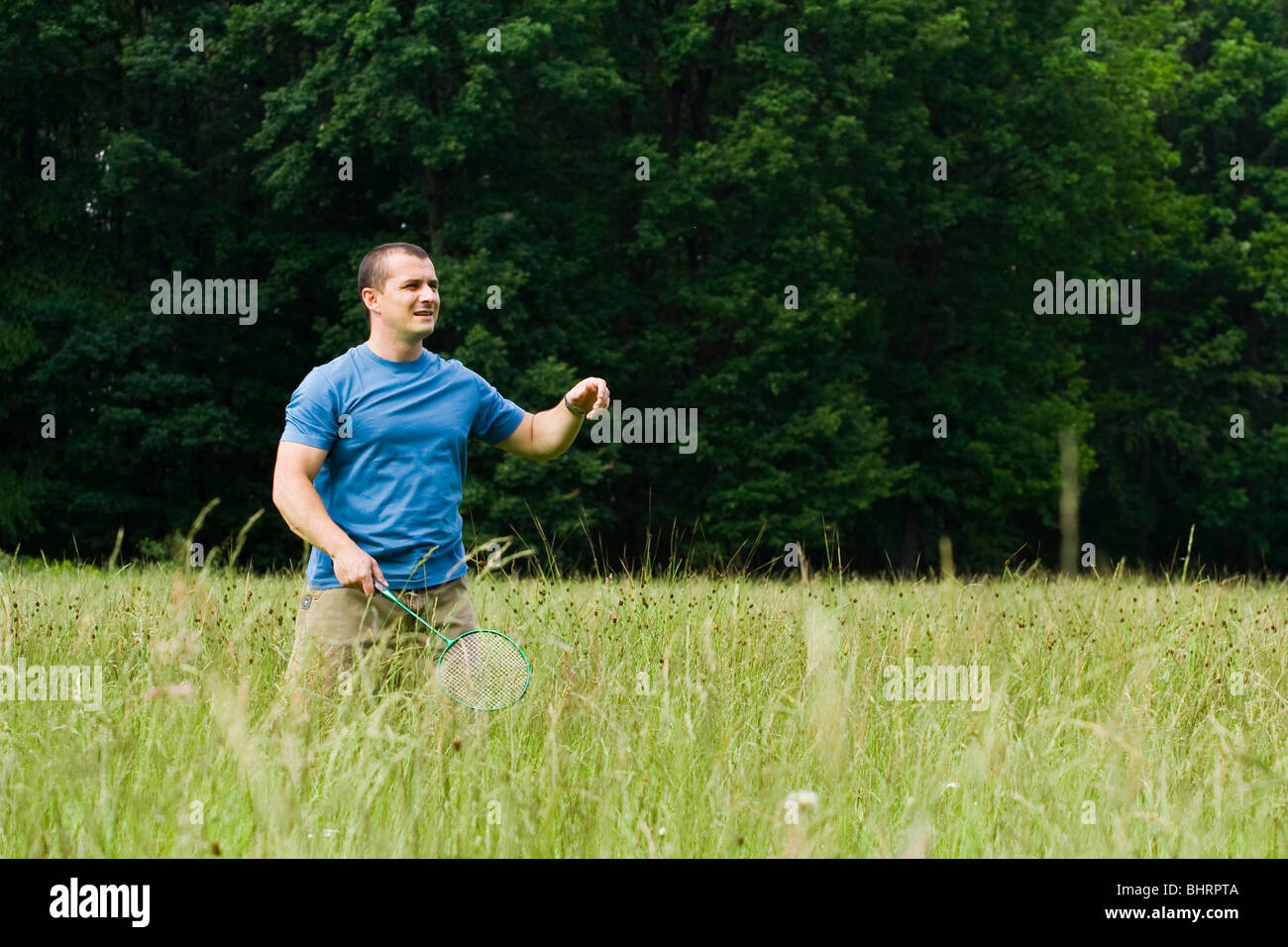 Young man playing badminton in a sunny day Stock Photo - Alamy