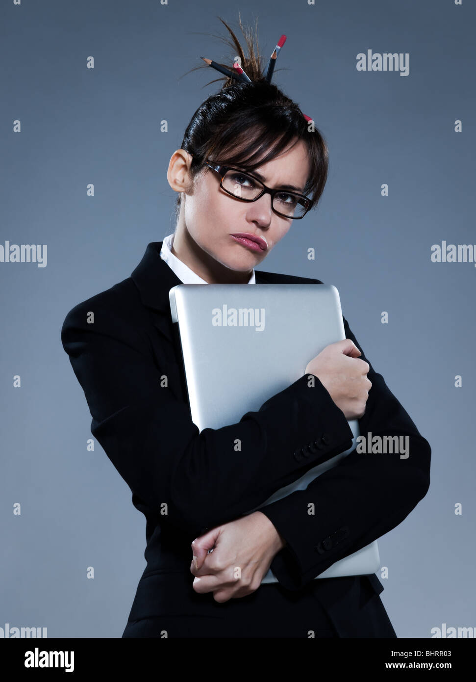 beautiful business woman hugging her computer laptop on isolated ...