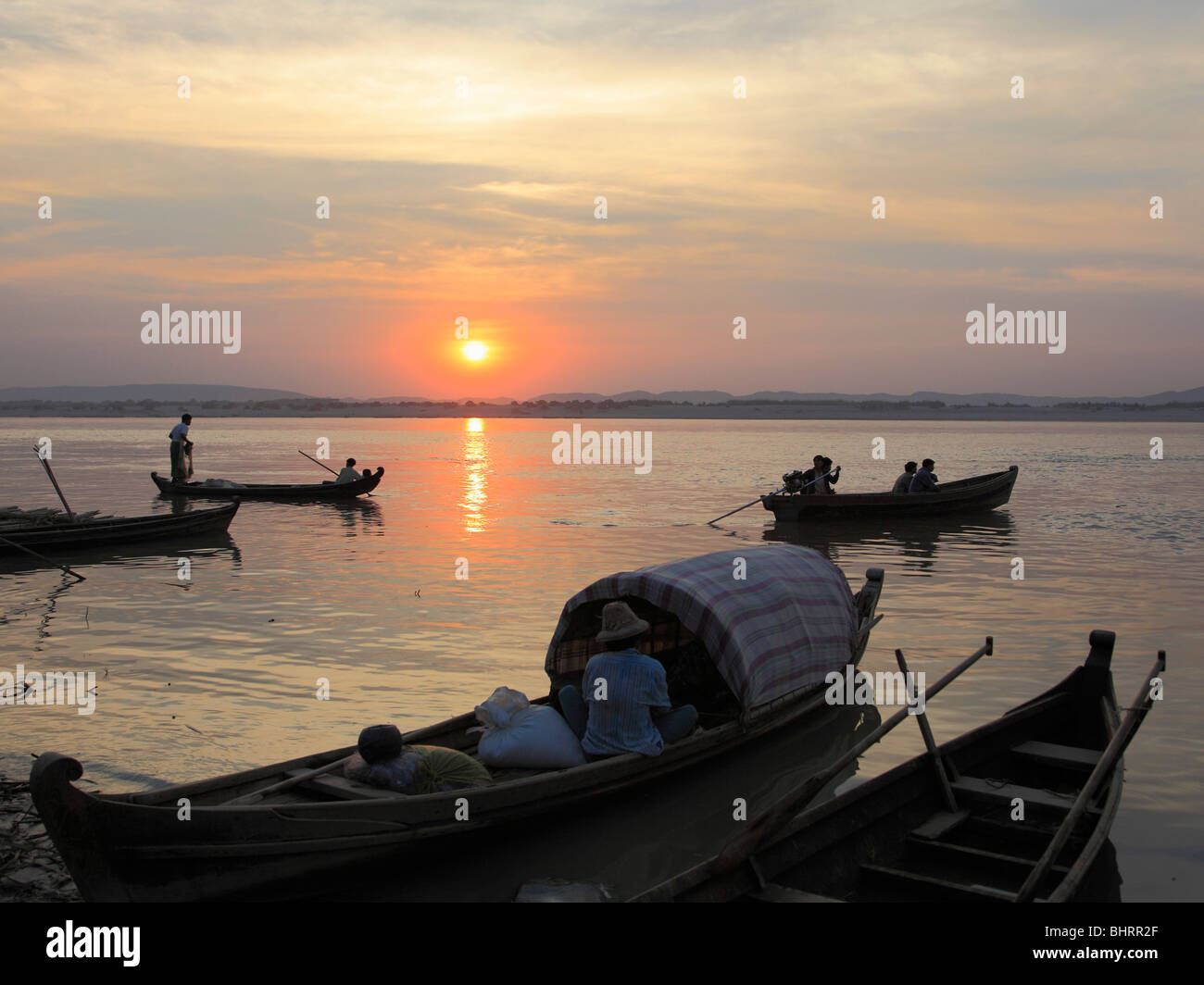 Myanmar, Burma, Mandalay, Ayeyarwaddy River, boats, sunset Stock Photo ...