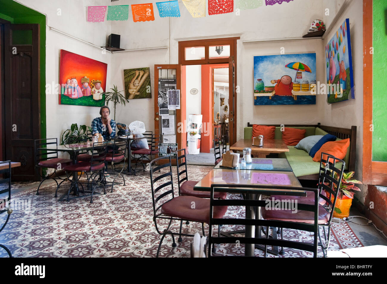 charming interior of small colorful light filled cafe restaurant with ...