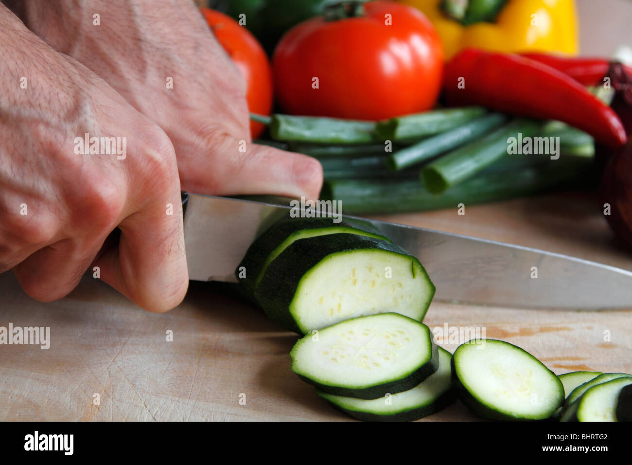 Mans hands cut red onions hi-res stock photography and images - Alamy
