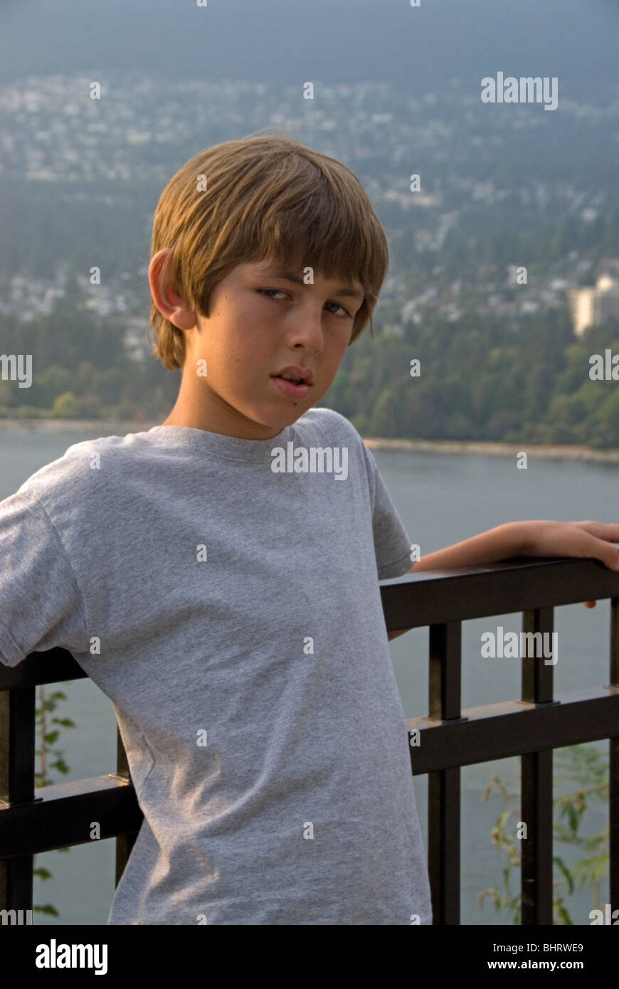Young boy standing at a railing at Prospect Point in Stanley Park ...