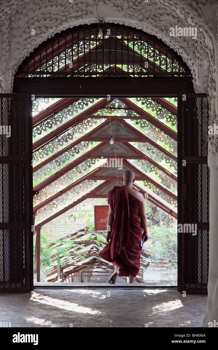 Monk at door at monastery in Myanmar Stock Photo - Alamy