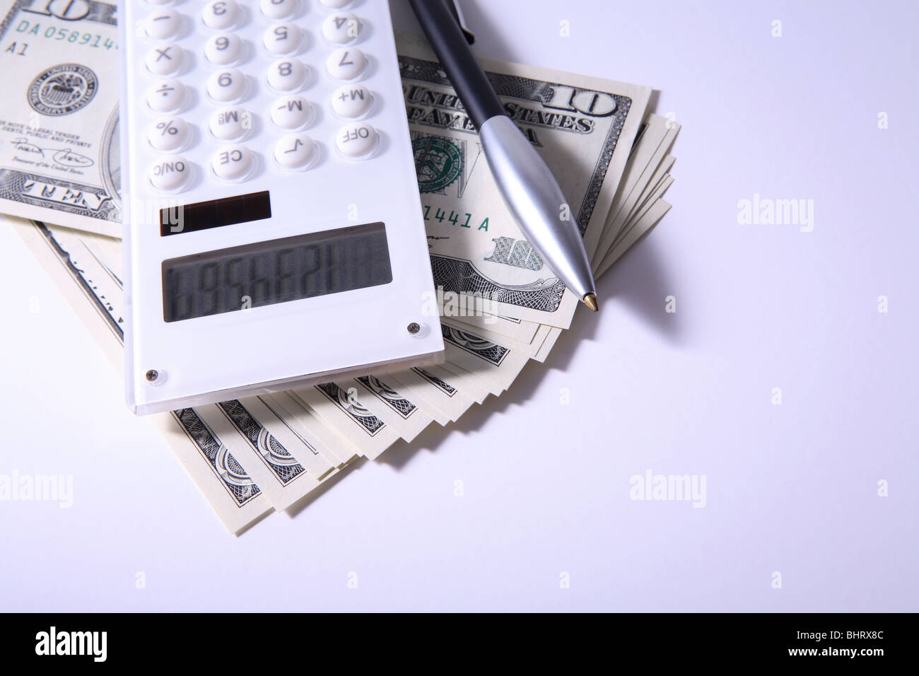 Calculator and Dollar Stock Photo - Alamy