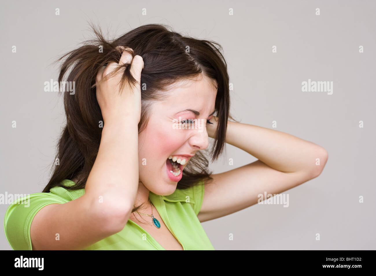 Close-up portrait of a beautiful woman screaming Stock Photo - Alamy