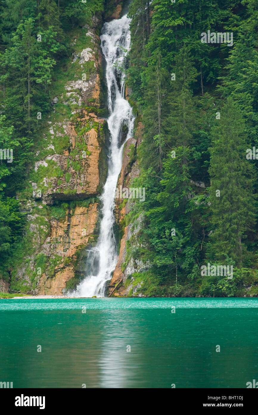 Landscape with a waterfall and a lake between mountains Stock Photo - Alamy