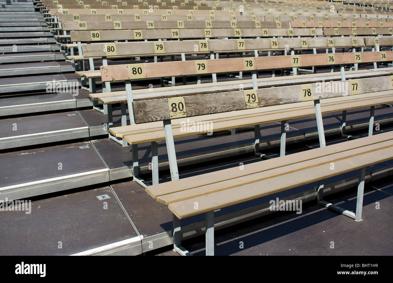 Rows of benches in an outdoor arena Stock Photo - Alamy