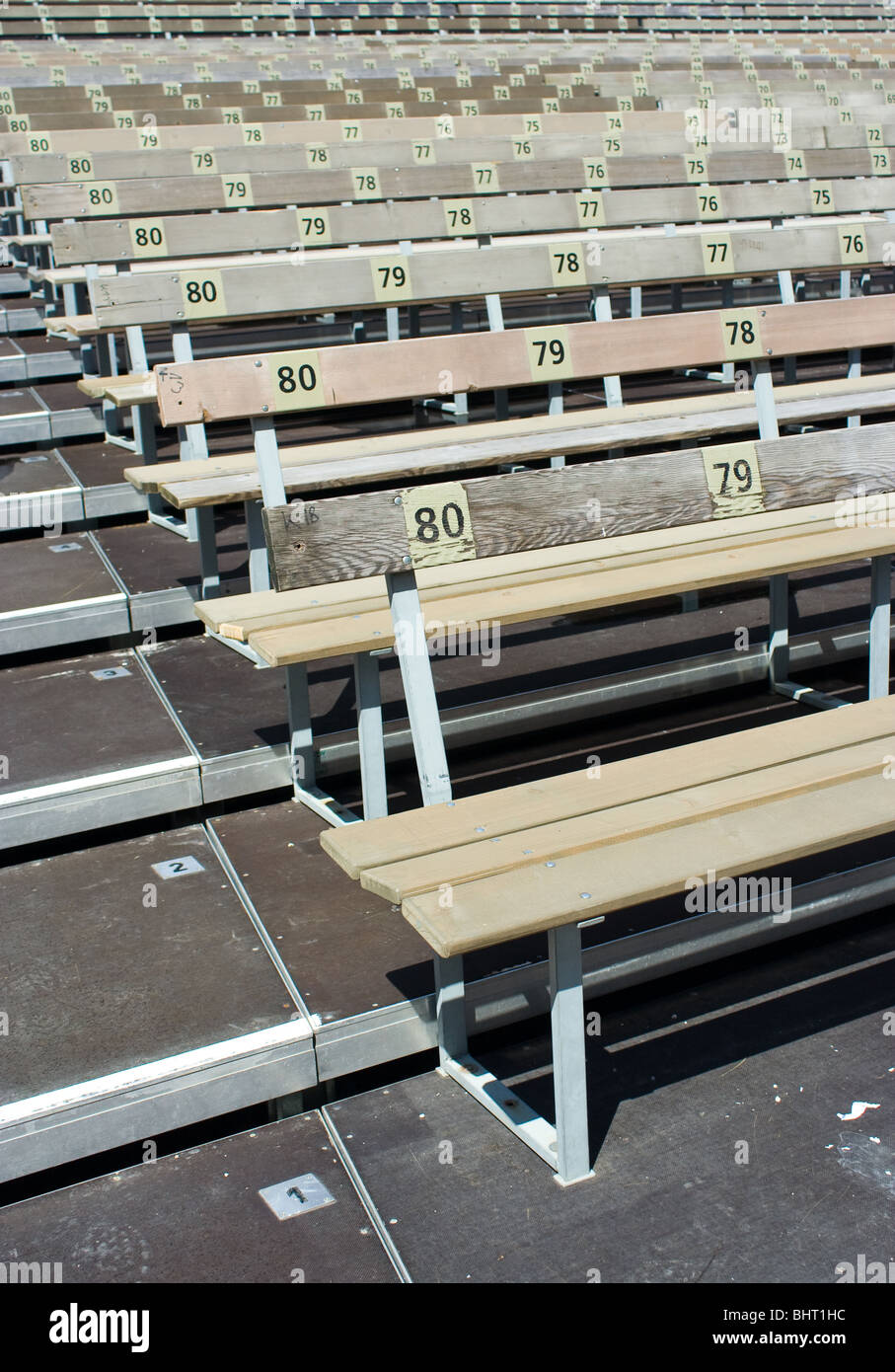 Rows of benches in an outdoor arena Stock Photo - Alamy