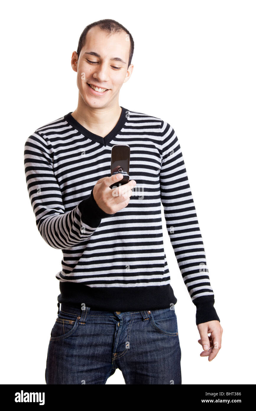 Happy young guy sending a text message, isolated on white background ...