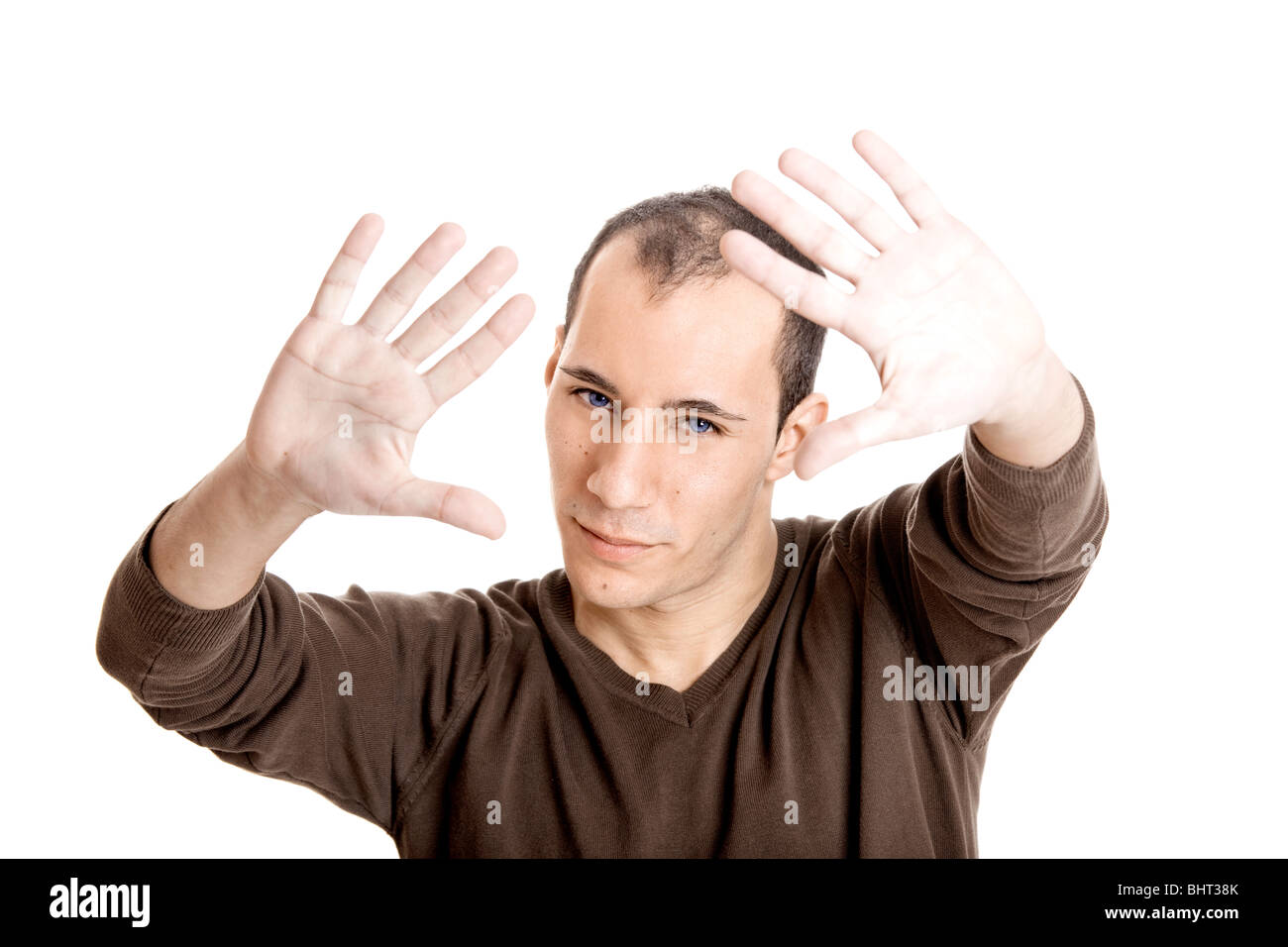 Portrait of a young man with both hands on the air, isolated on white ...