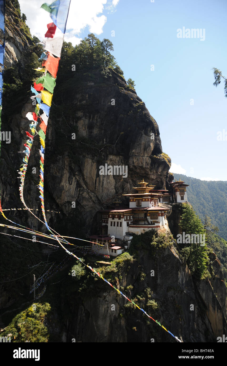 temple on a cliff face with prayerflags Stock Photo - Alamy