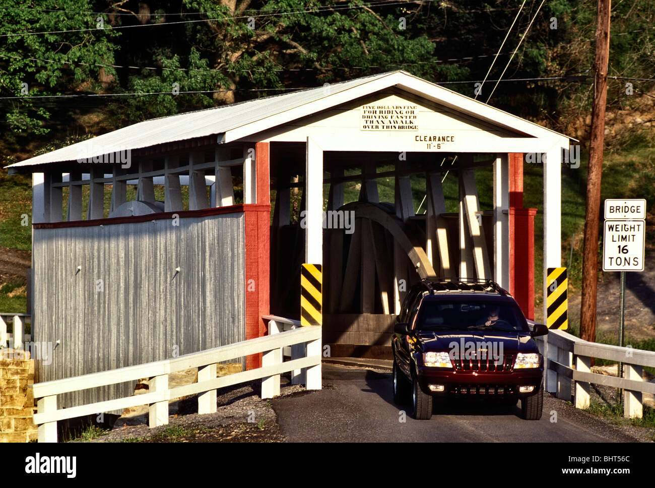 Jeep crossing a covered bridge in West Virginia USA Stock Photo - Alamy