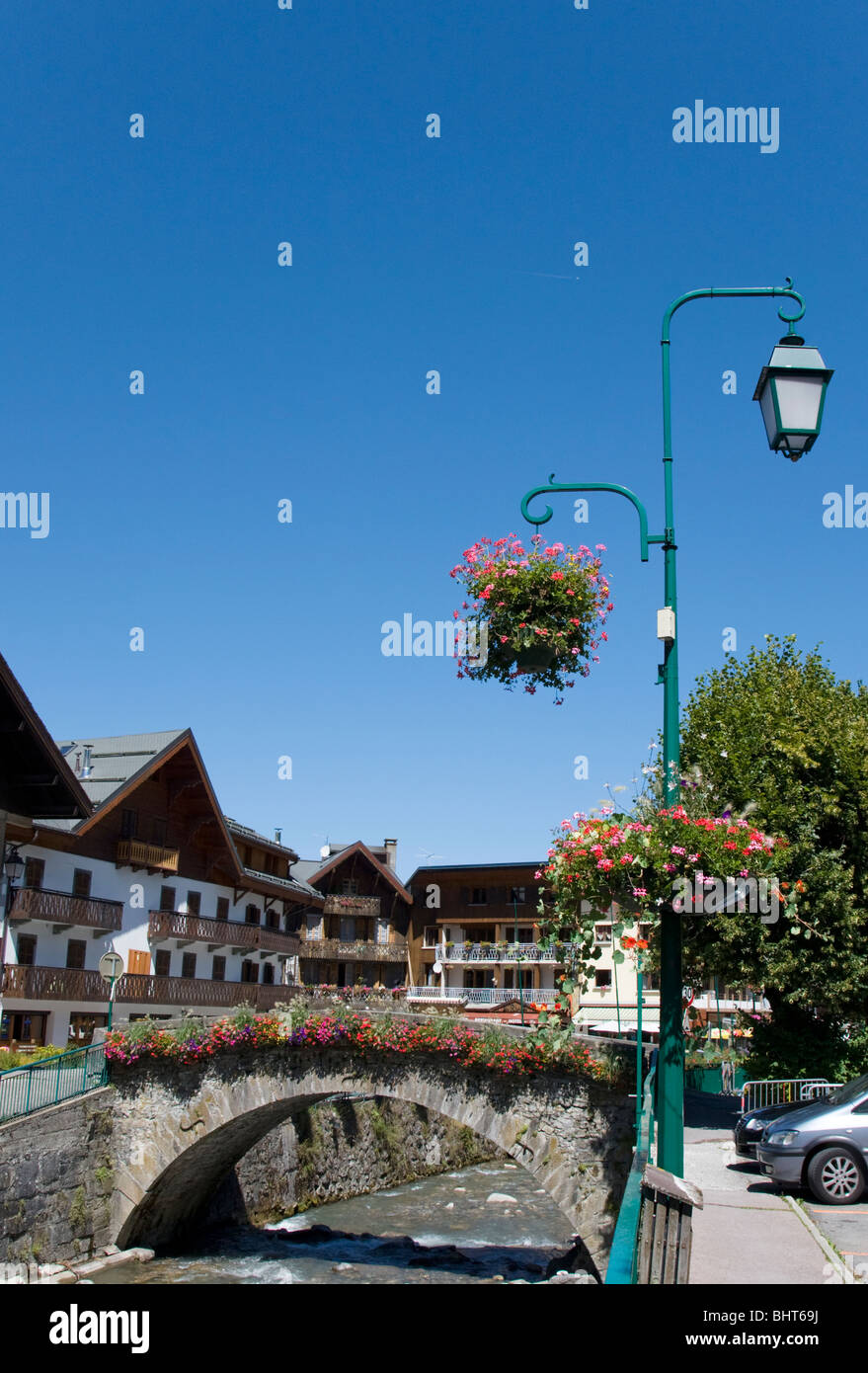 Bridge over the river Dranse in Morzine summer Stock Photo - Alamy