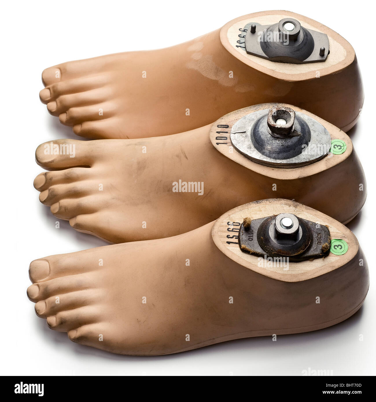 three left artificial feet on white Stock Photo - Alamy