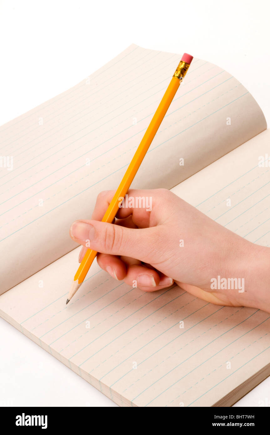 hand on white writing on pad with pencil Stock Photo - Alamy