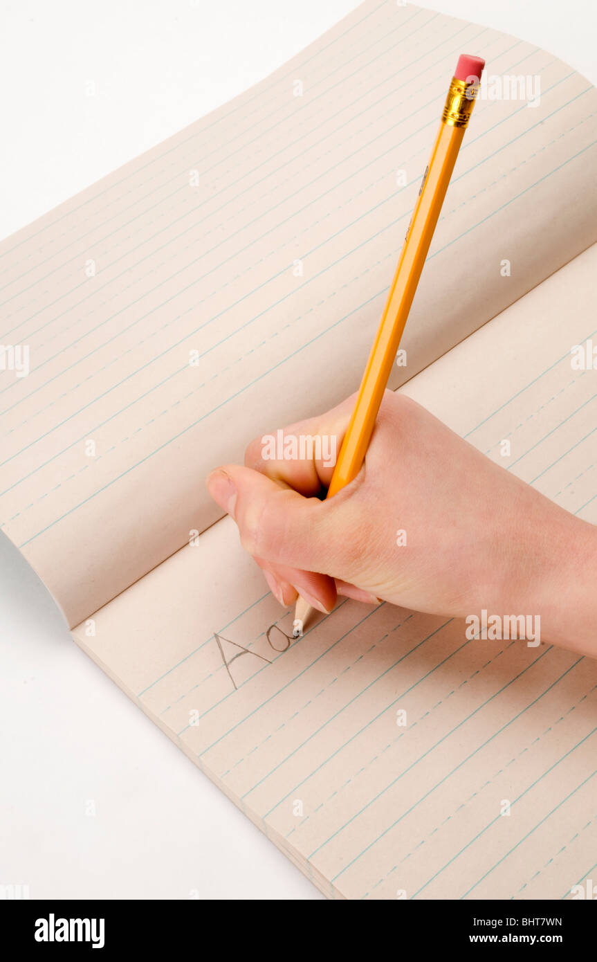 Child's hand writing on paper hi-res stock photography and images - Alamy