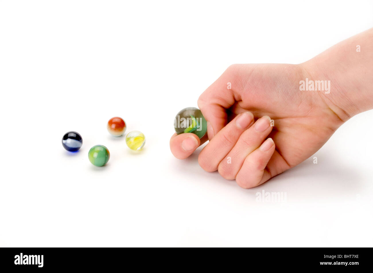 Hand holding marbles hi-res stock photography and images - Alamy