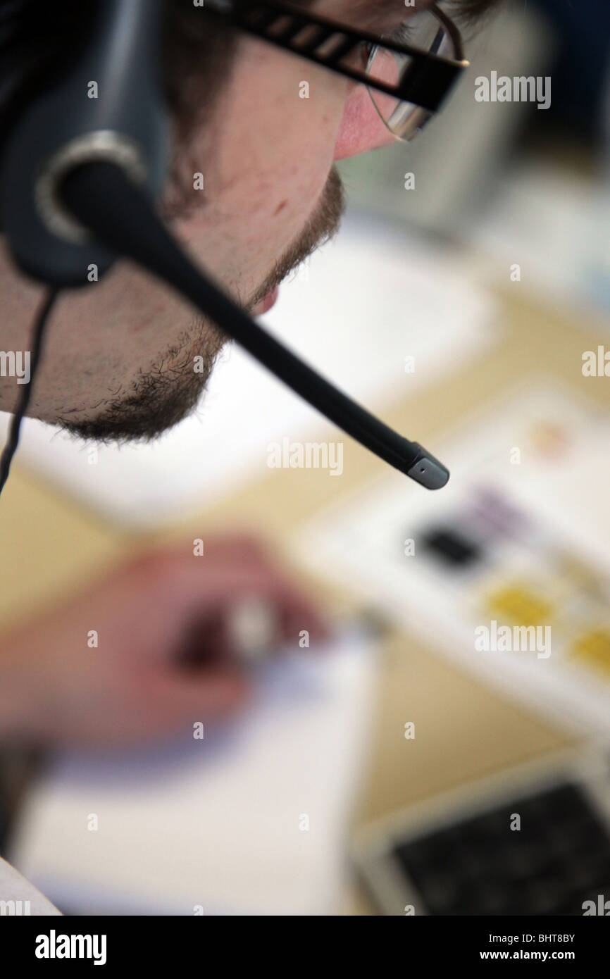 Call centre staff on the phone Stock Photo - Alamy