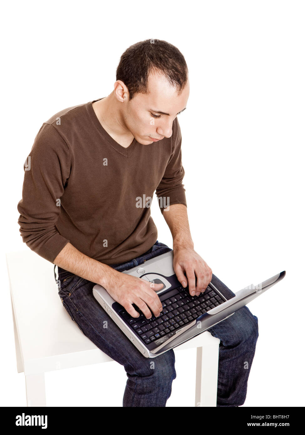 Young man working on a laptop, isolated on white Stock Photo - Alamy
