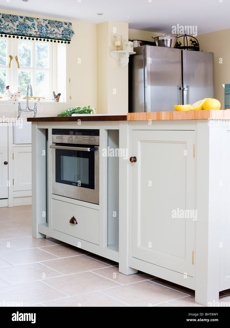 Stainless steel oven in island unit in country kitchen Stock Photo Alamy