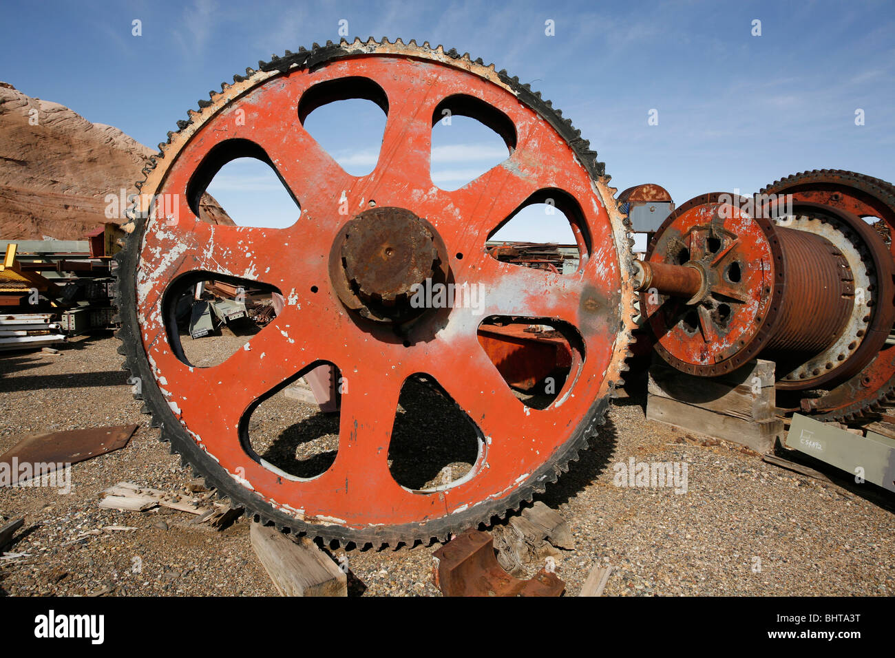 Gigantic industrial gear in scrap yard Stock Photo - Alamy