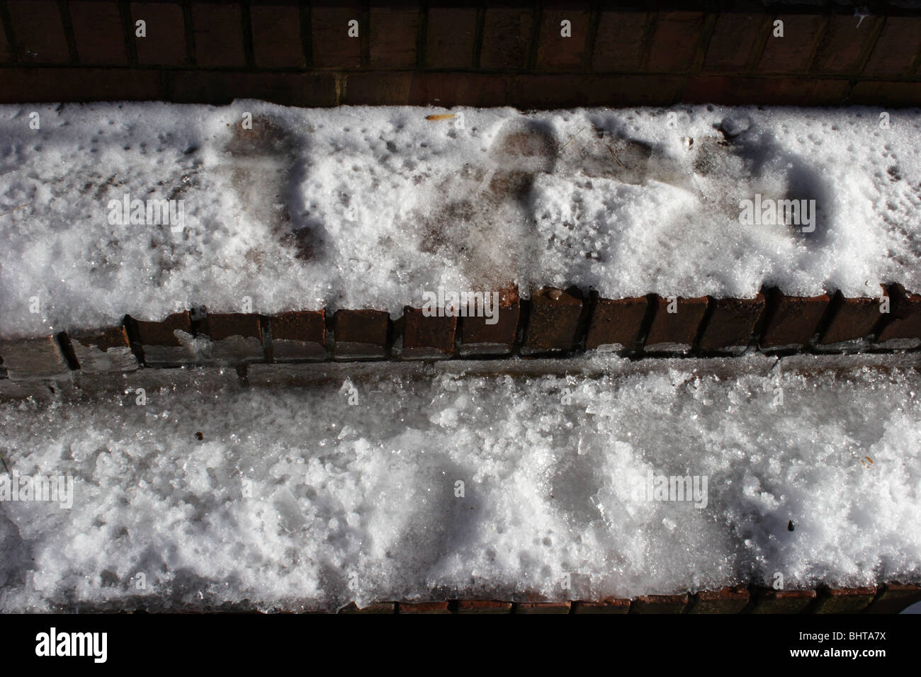 Brick steps covered with snow and ice Stock Photo - Alamy