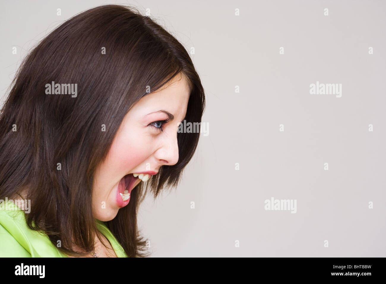 Close-up portrait of a beautiful woman screaming Stock Photo - Alamy