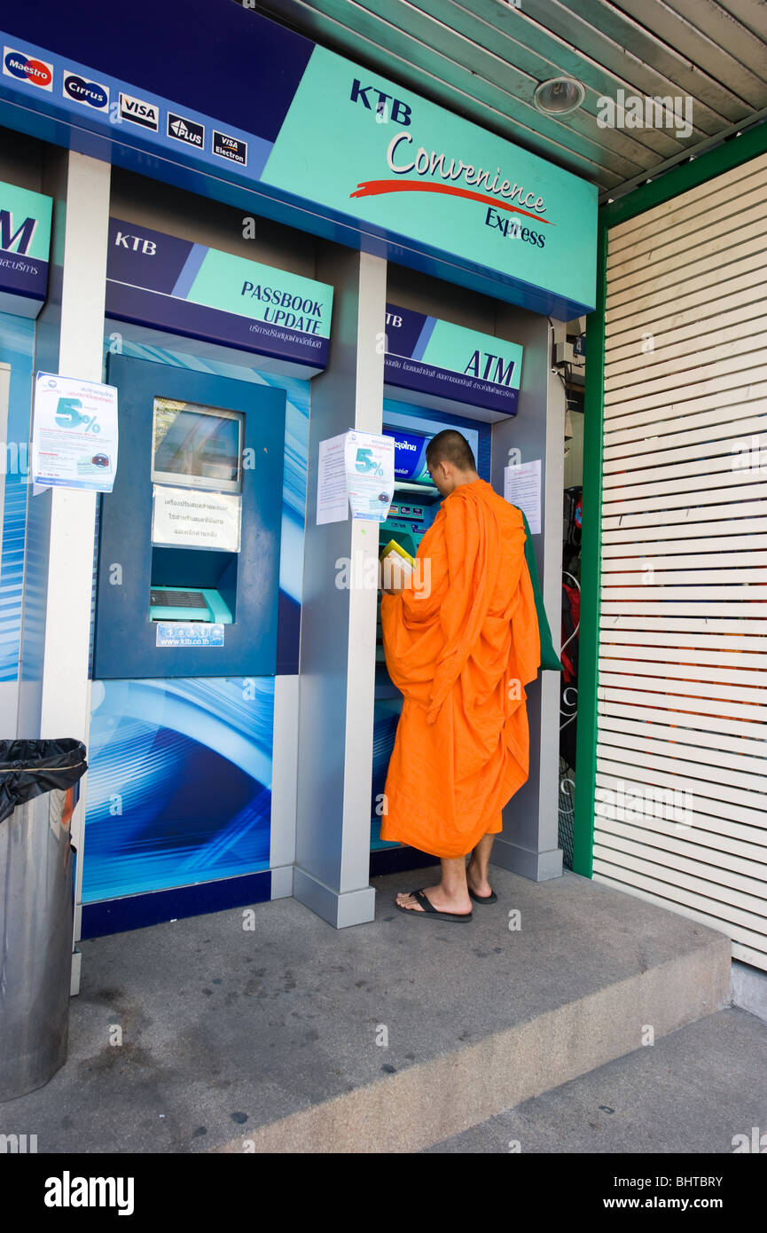 Monk and ATM machine Stock Photo - Alamy