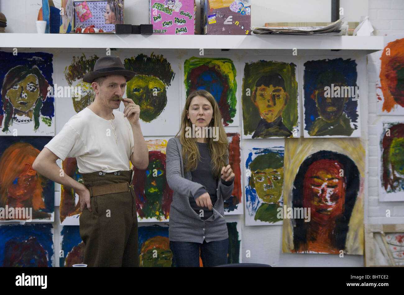 Billy Childish artist, discussing a students work with lecturer Stock ...