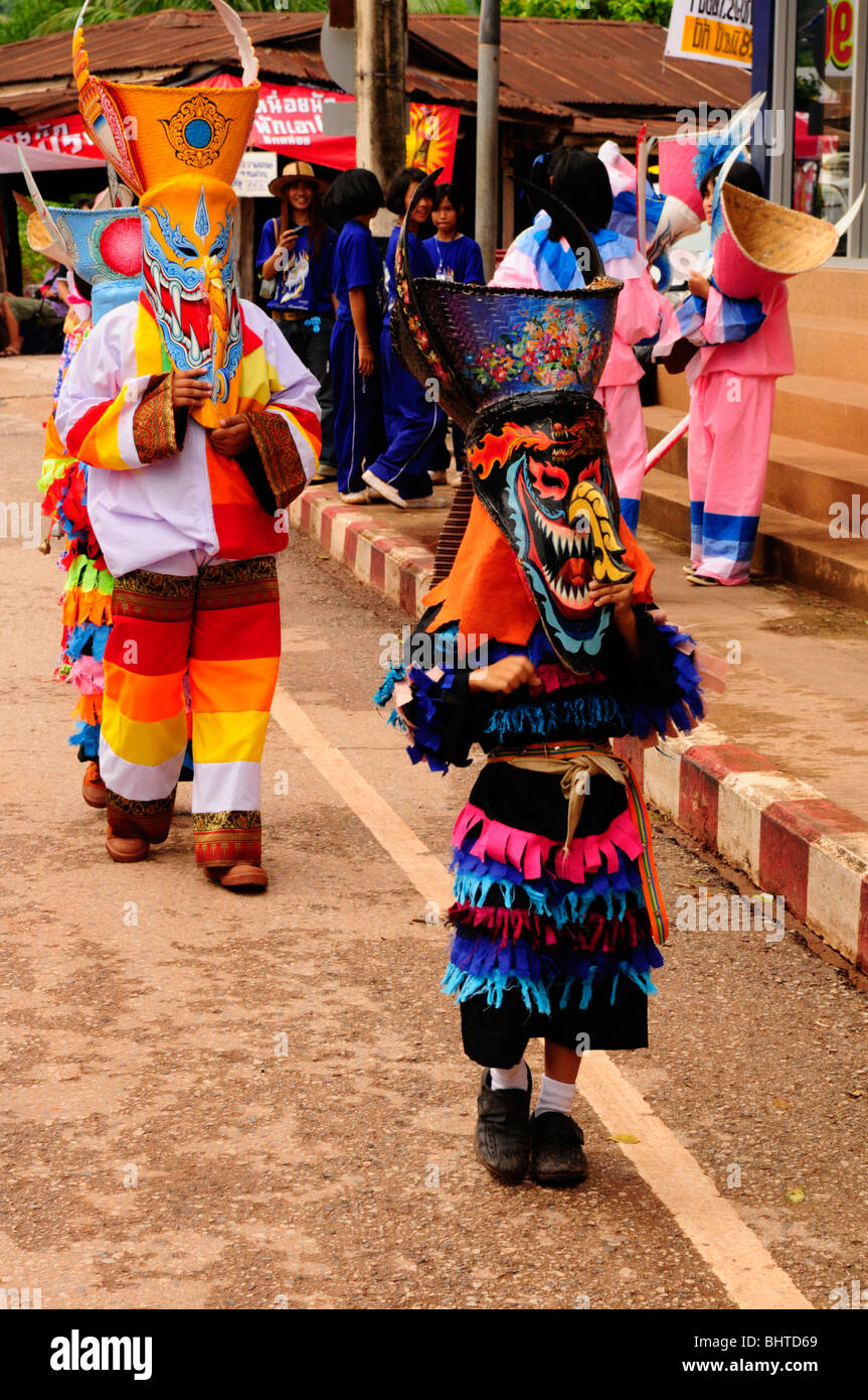 boys in ghost costumes and masks , phitakon festival (phi ta khon ...
