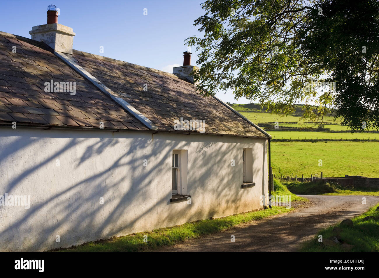 Shadows on a traditional Irish farmhouse near Ballycastle on the north ...