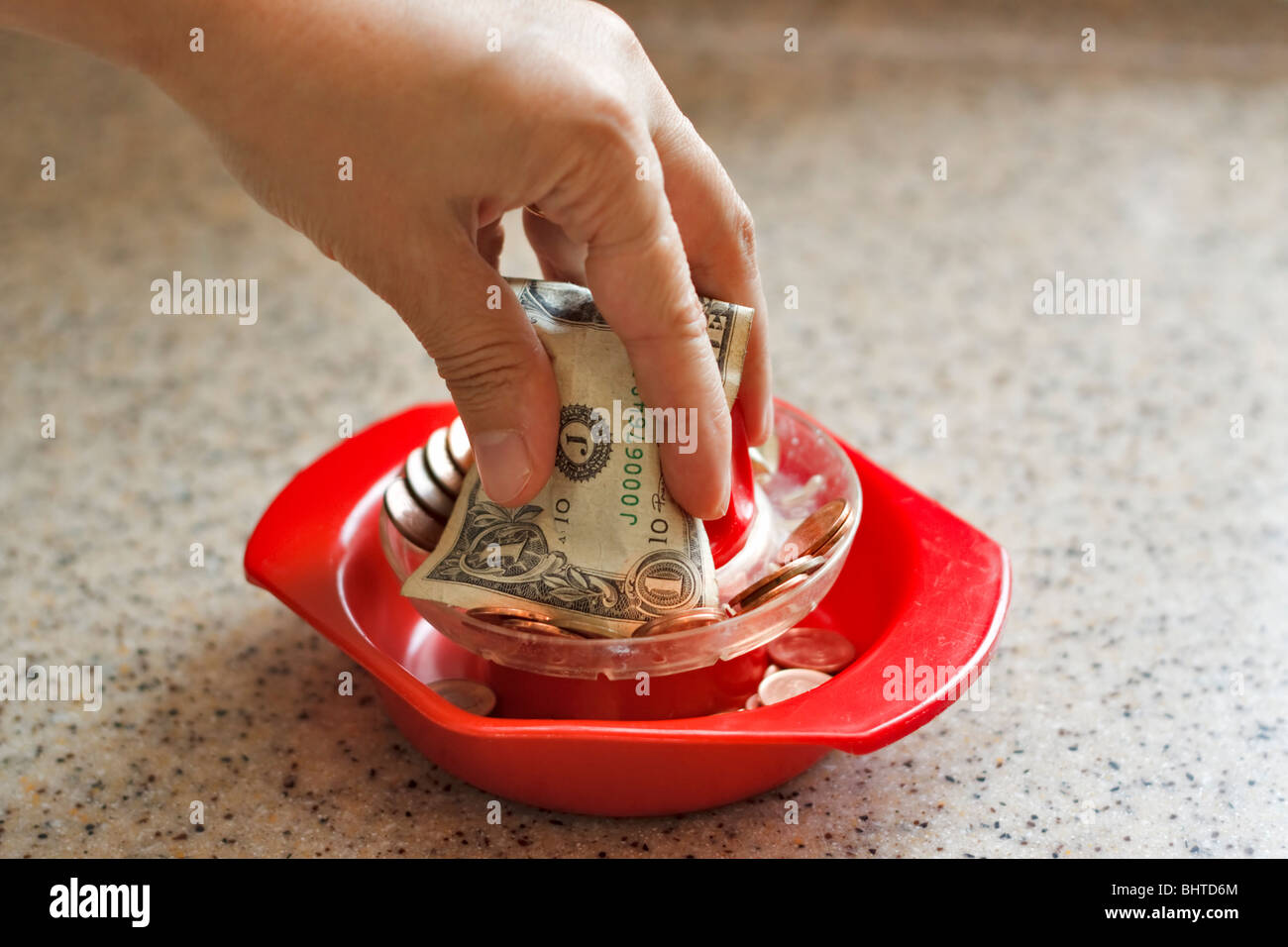 Squeezing a dollar Stock Photo - Alamy