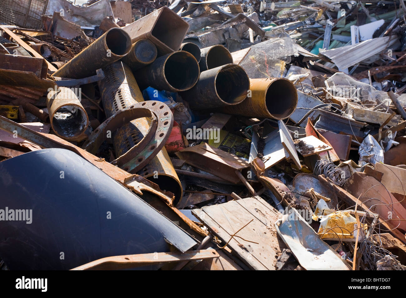 Various pile of scrap metal and pipes at scrap metal yard Stock Photo ...