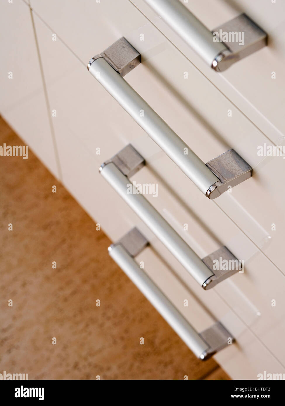 Close-up of brushed-steel handles on modern kitchen drawers Stock Photo ...