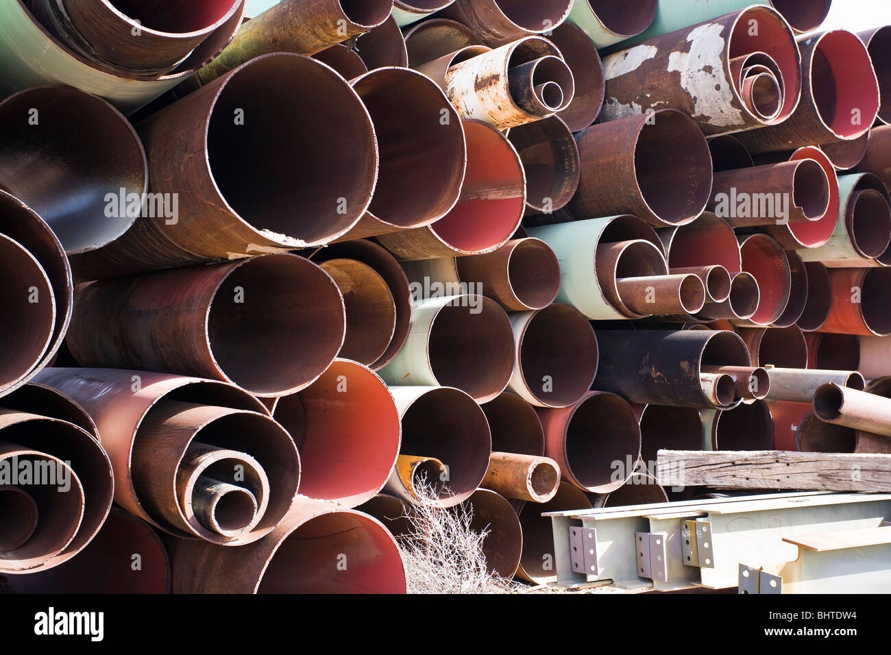 Large used scrap metal pipes, at scrap metal yard Stock Photo - Alamy