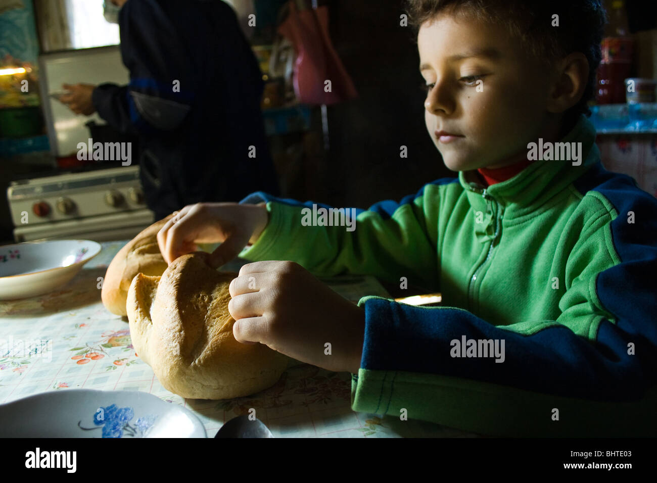 Poor child eating bread hi-res stock photography and images - Alamy