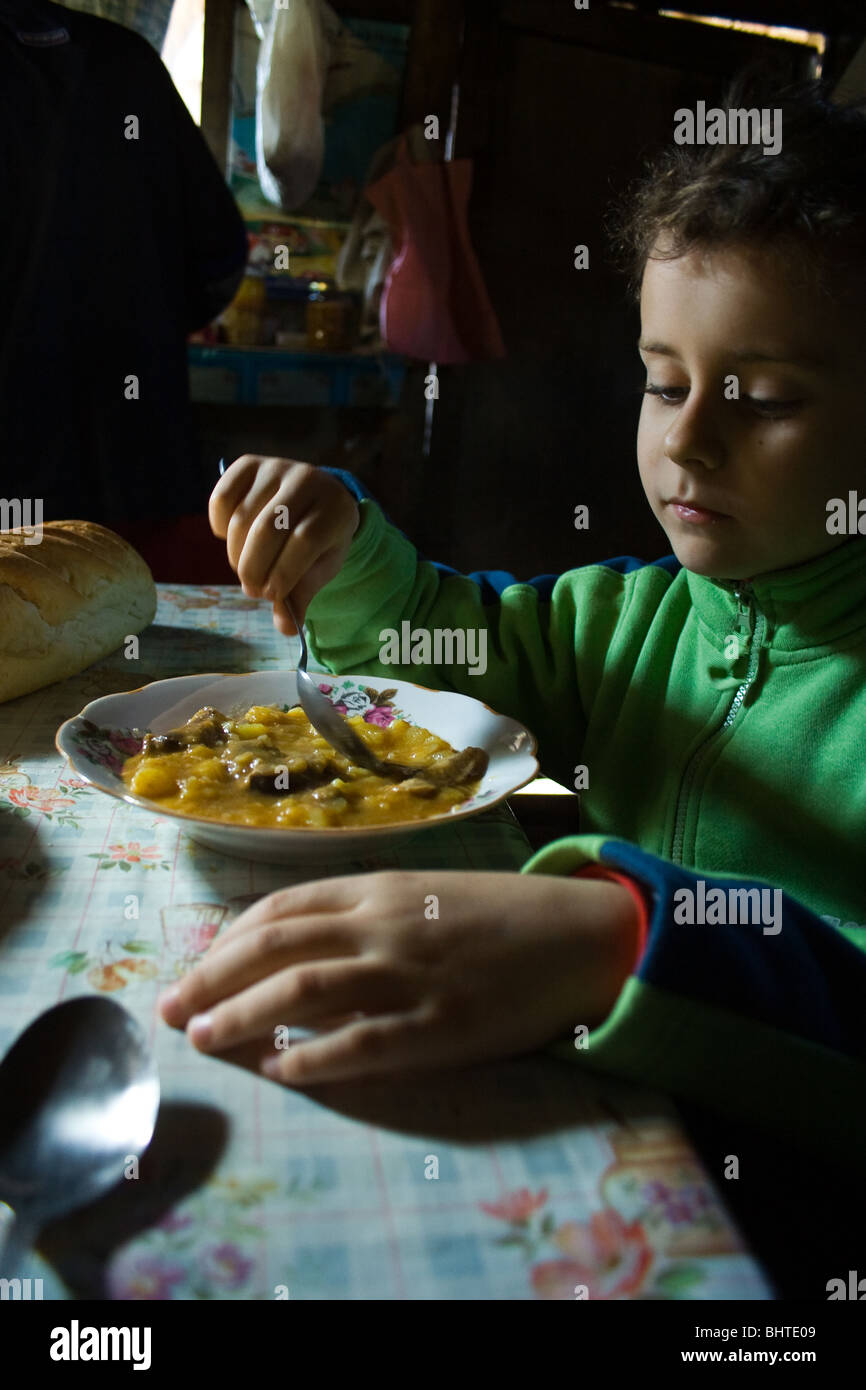 Cute kid eating soup Stock Photo - Alamy