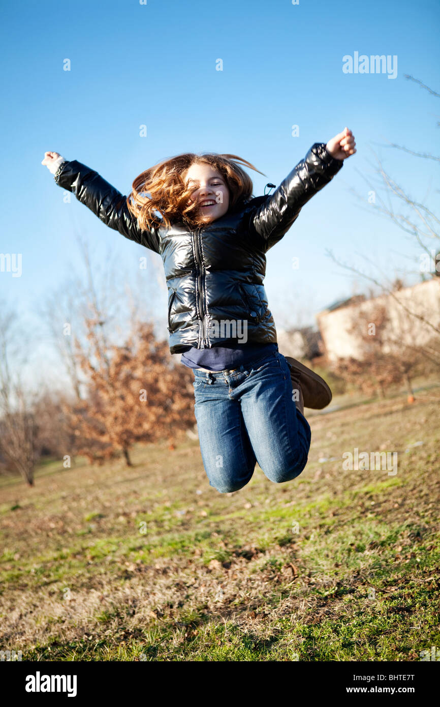 Girl jumping high hi-res stock photography and images - Alamy
