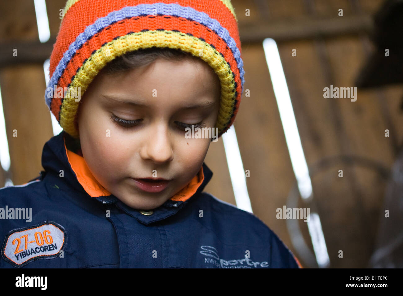 Boy looking down Stock Photo - Alamy