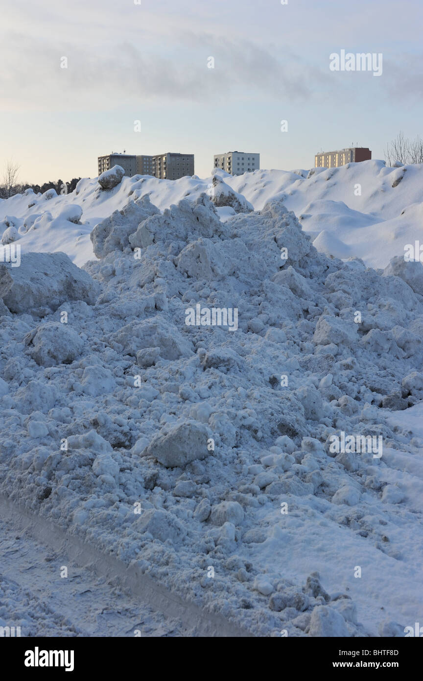 Piles of snow from the snow clearance this snowy winter Stock Photo - Alamy